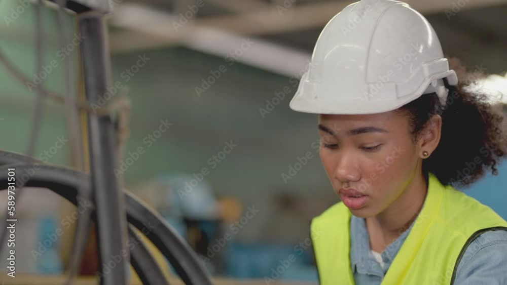 workers factory African woman working at heavy machine. group of people ...