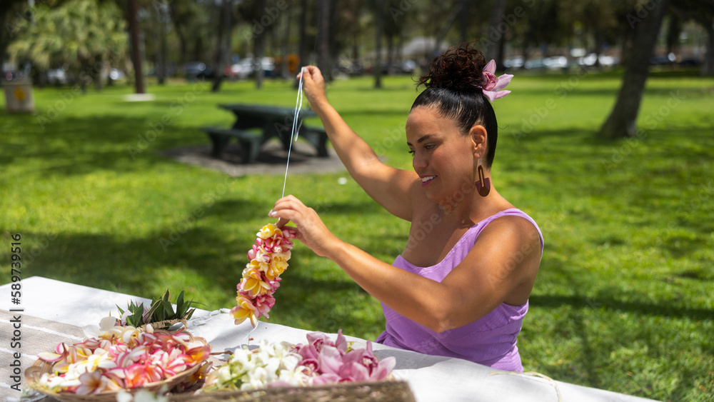 Woman making Hawaiian Lei and Hahu. Process of Handmade flower crown ...