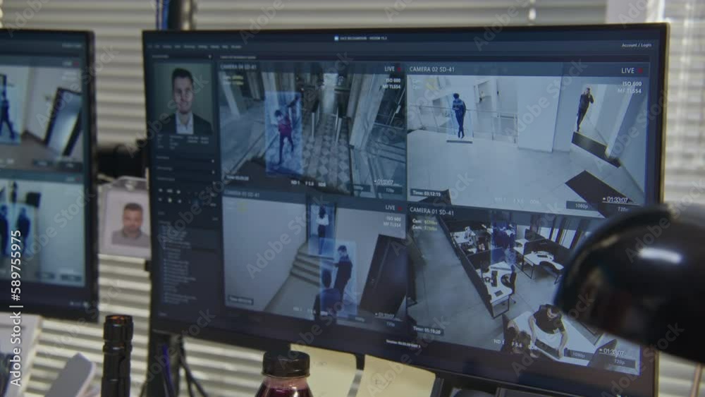 Stockvideo Close up shot of computers with screen showing footage of ...