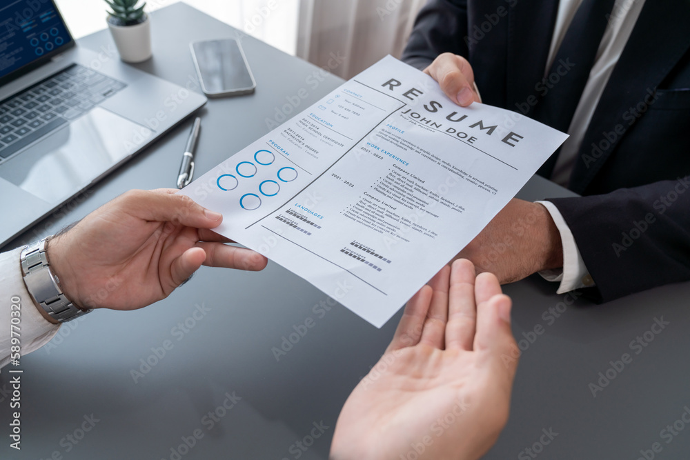 Confident man wearing suit in formal office, hand holding resume paper ...