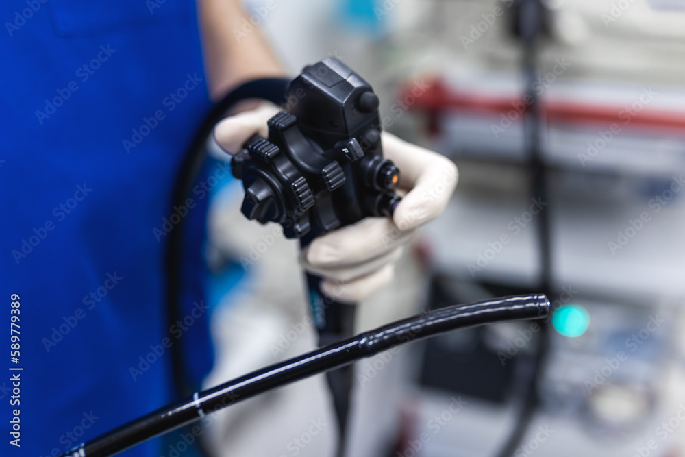 Endoscopy at the hospital. Doctor holding endoscope before gastroscopy ...