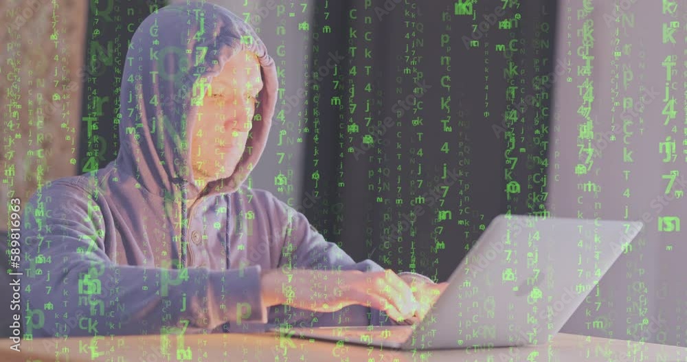 Vidéo Stock Hooded programmer works on laptop at home. Side view ...