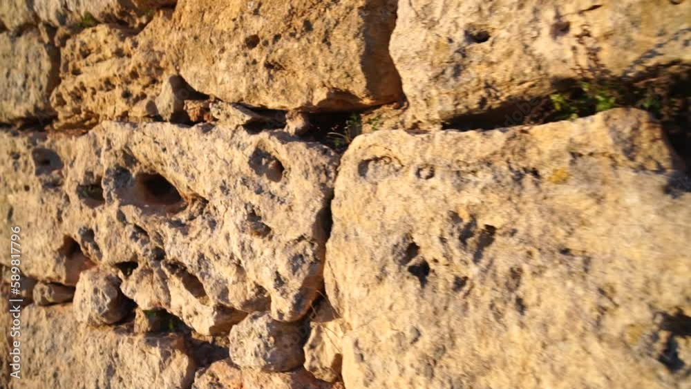 Ancient Stone Wall - Limestone. Fence is made of crude stone limestone ...