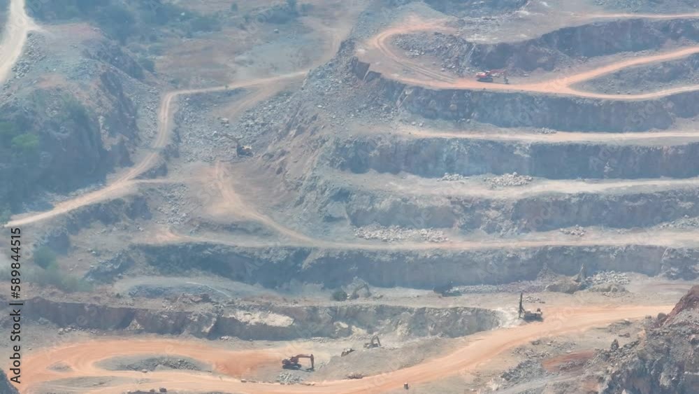 A quarry seen from an aerial view typically appears as an expansive ...