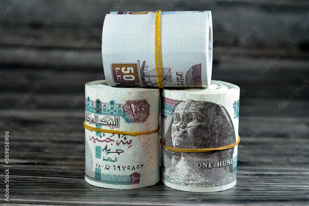 Rolls of Egypt money banknote bills of 100 and 50 EGP LE one hundred ...