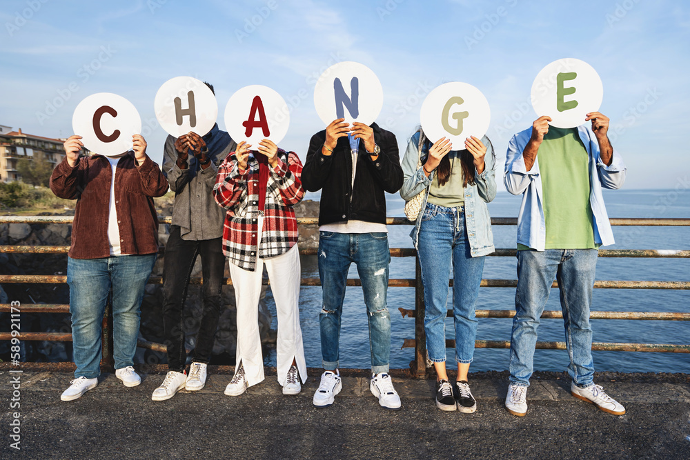 Youth Advocating for Change: Multiracial young people cover faces with ...