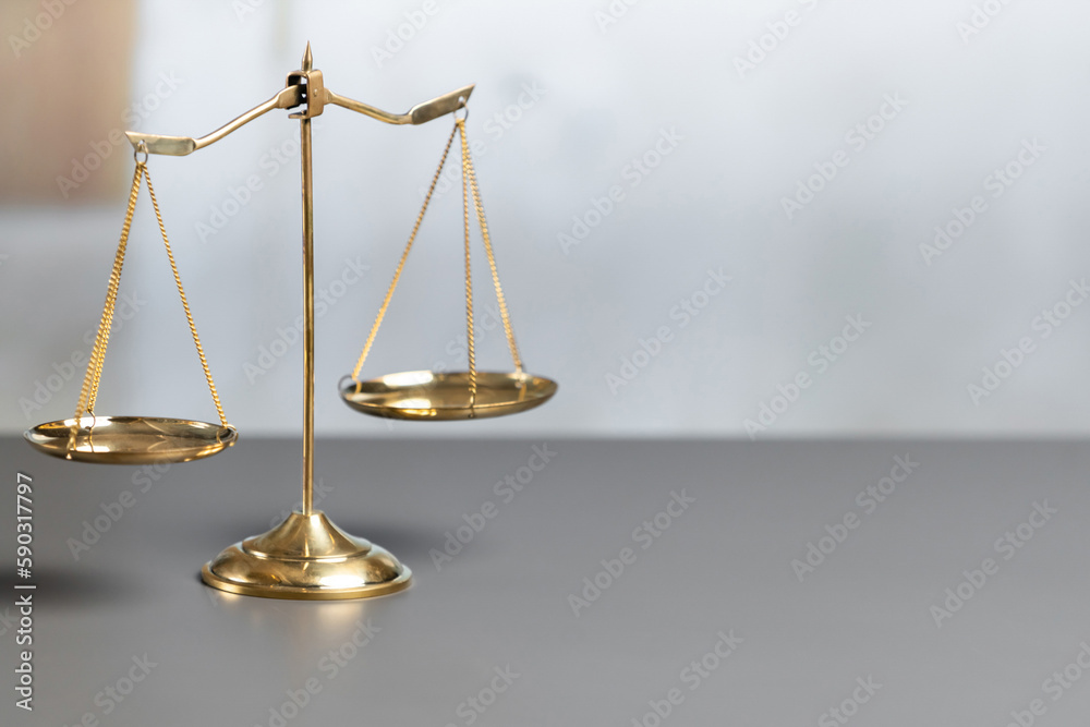 Shiny golden balanced scale in court library background as concept ...