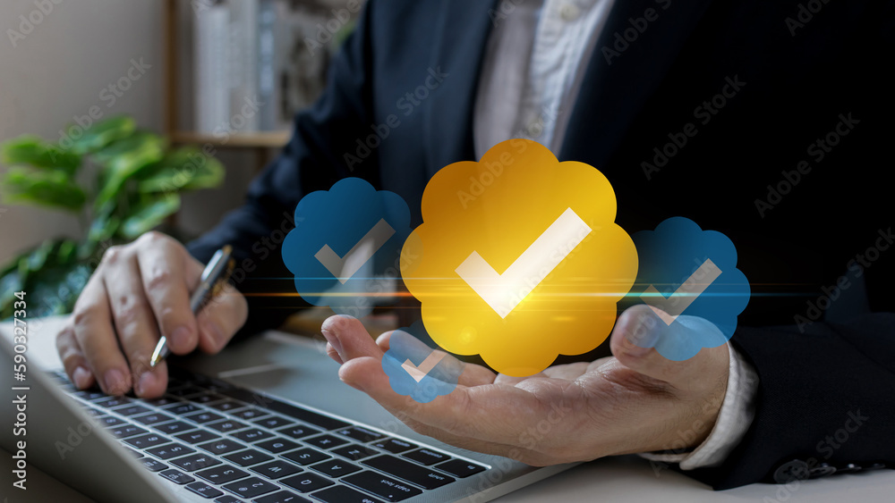 Businessman holding Gold check correct mark to verification account on ...