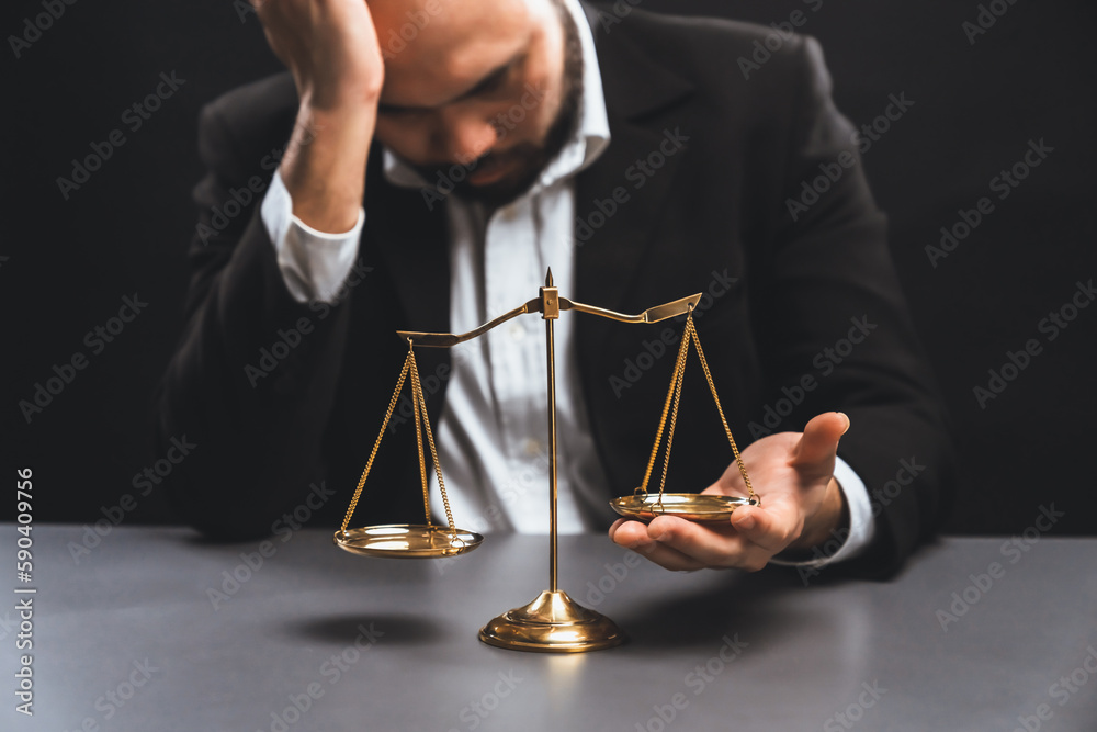Lawyer or judge in formal black suit hold unbalanced scale with ...