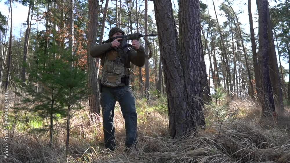 Soldier during a military operation, fully equipped camouflage on a ...