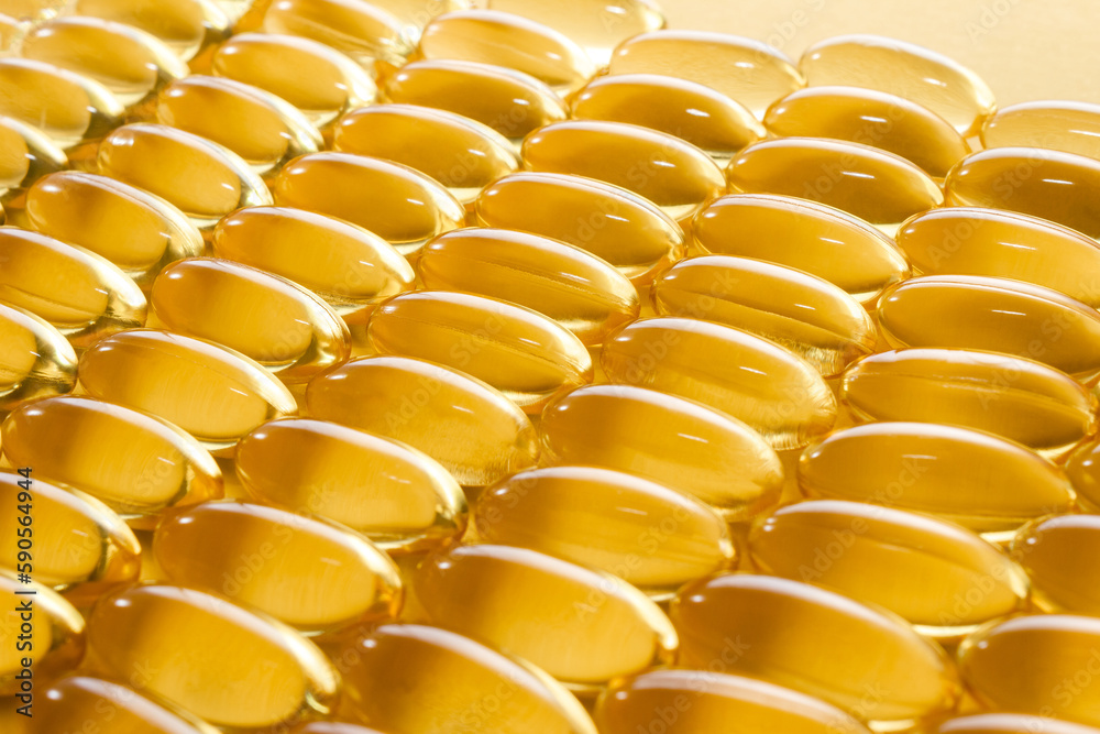 Yellow food supplement capsules with vitamin D3 and omega 3 ...