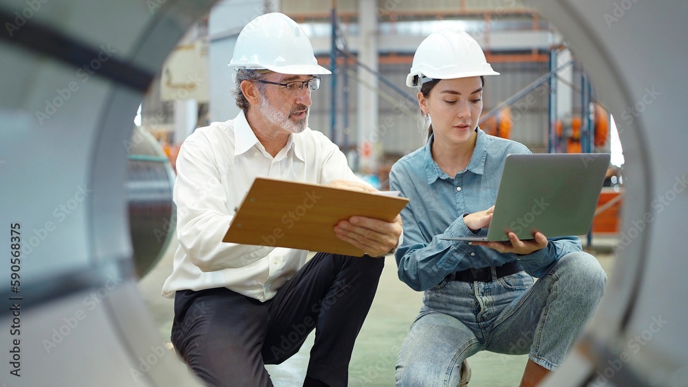 Two engineer manager leader and woman assistant holding laptop wearing ...