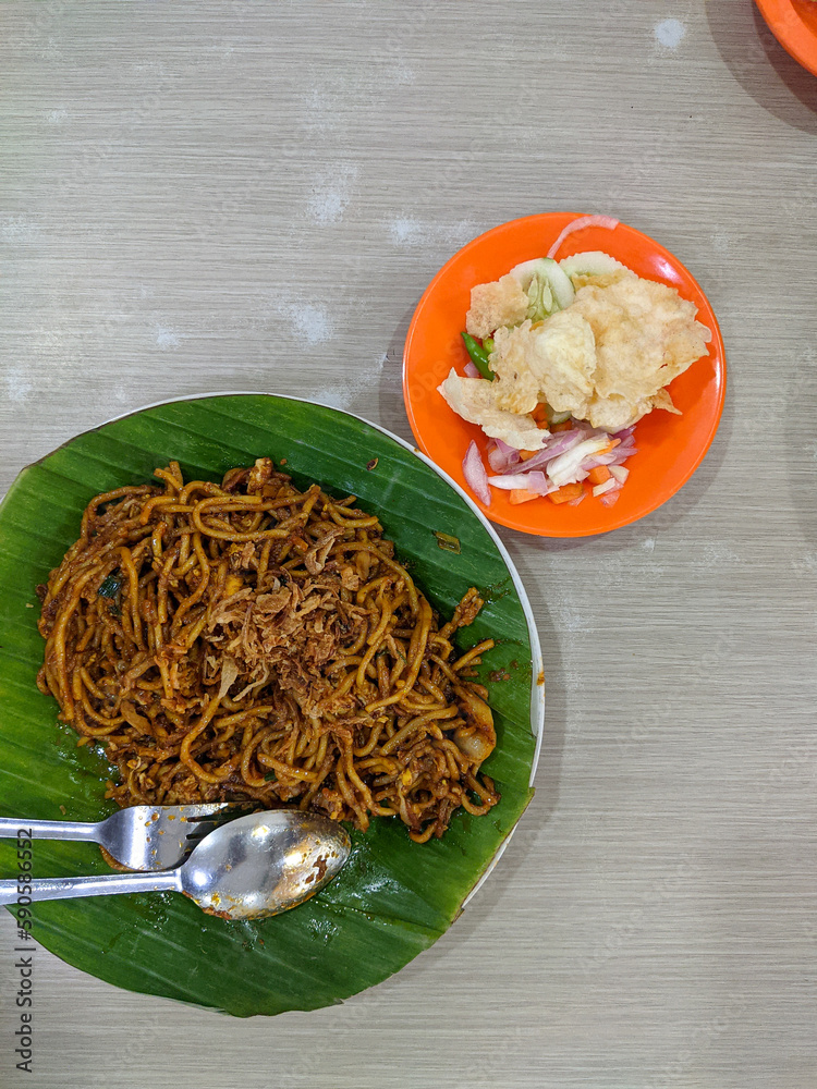 Mi Aceh is a spicy noodle dish typical of Aceh in Indonesia. Thick ...