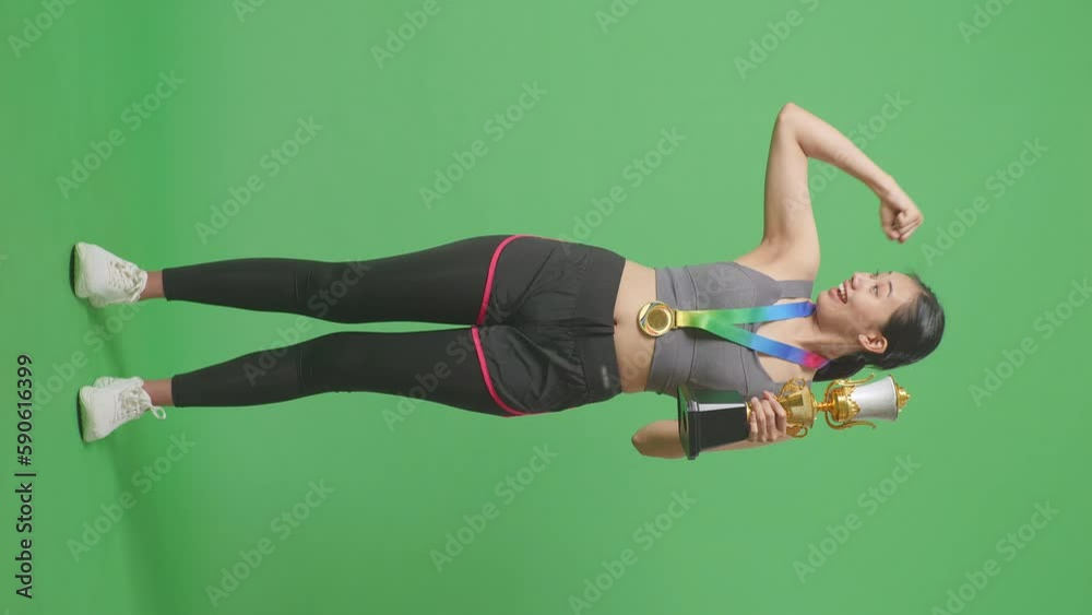 Full Body Of Asian Woman With A Gold Medal And Trophy Flexing Her Bicep ...