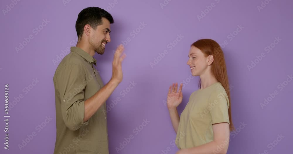 deaf people communicating with sign language. man and red-haired girl ...