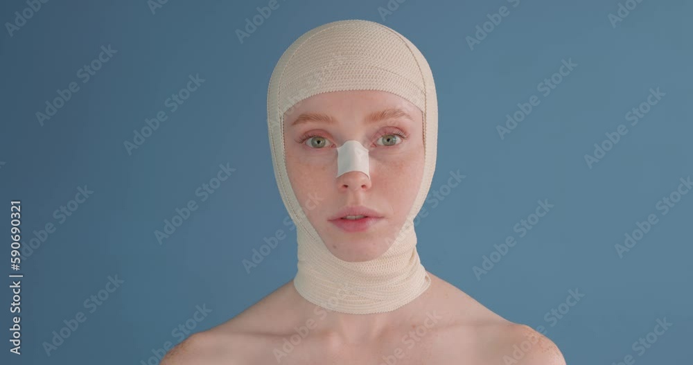 Serious woman in headwrap opening eyes looking at camera Pale girl with ...