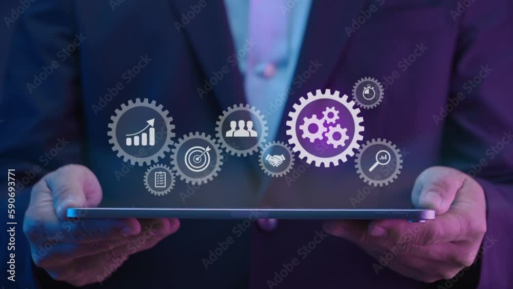 Businessman showing virtual screen of gear cog icon present operation management involving ...