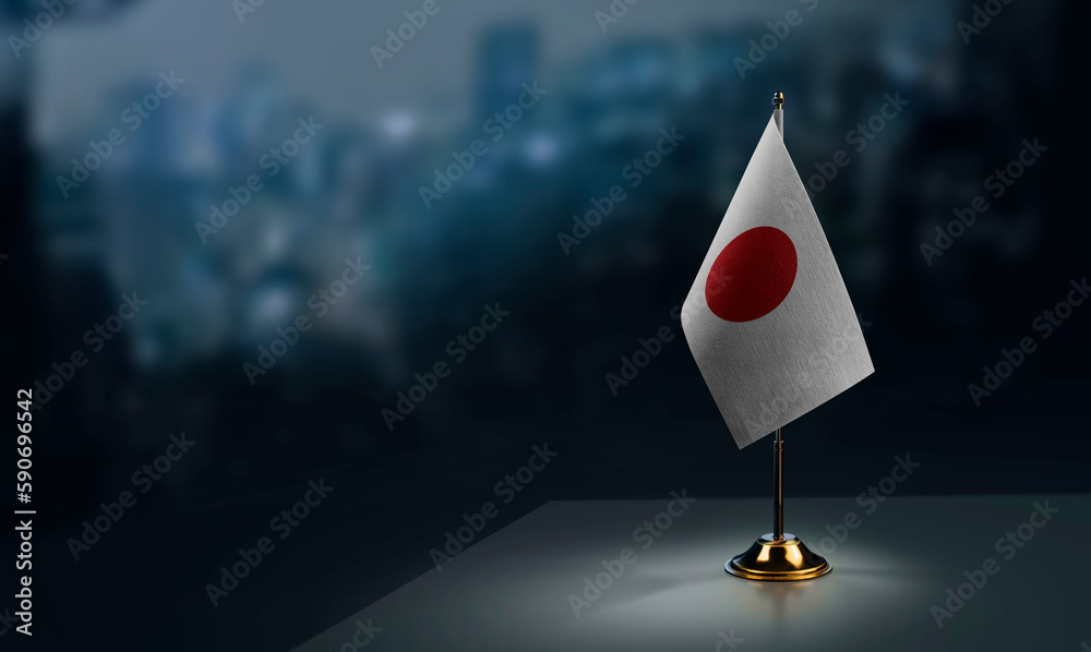 Small flags of the Japan on an abstract blurry background Stock Photo ...
