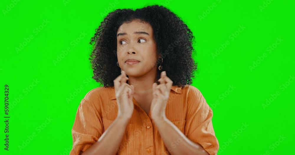 Woman, fingers crossed and pray with hope by green screen with stress ...