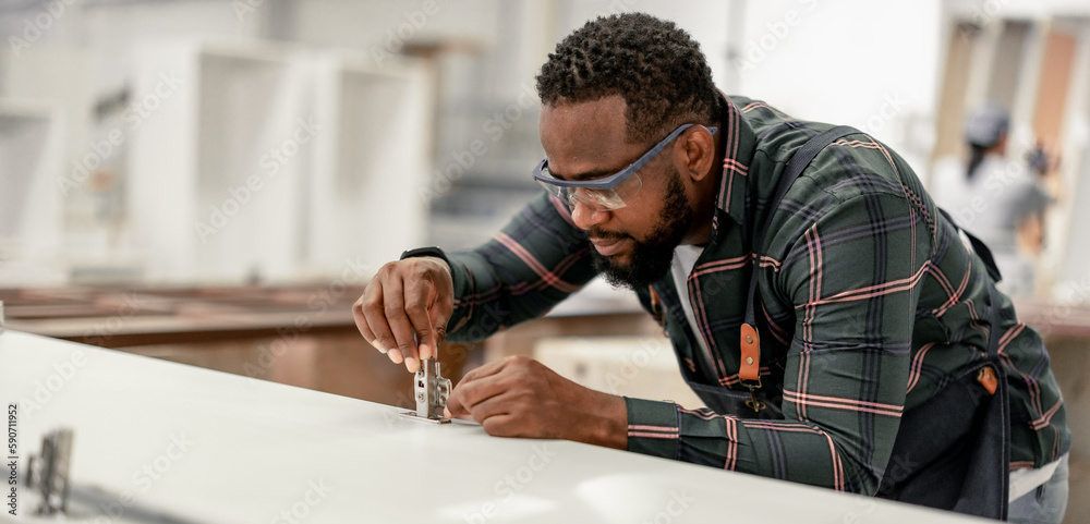 A Carpenter carefully measures, marks dimensions, and lays out ...
