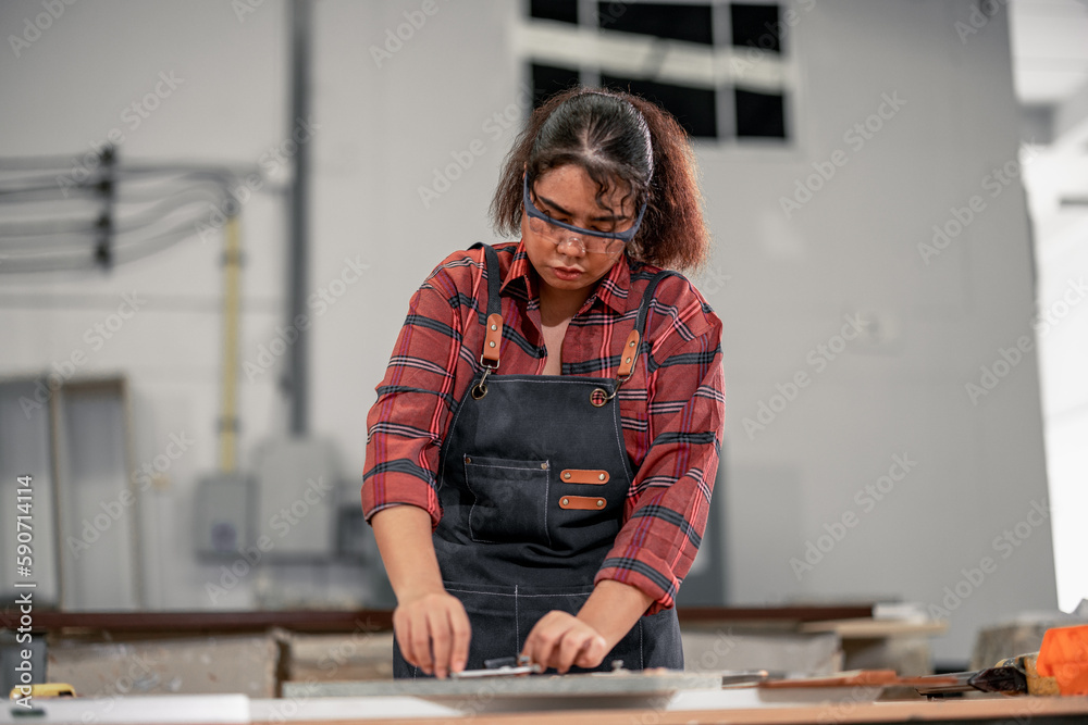 A Carpenter carefully measures, marks dimensions, and lays out ...