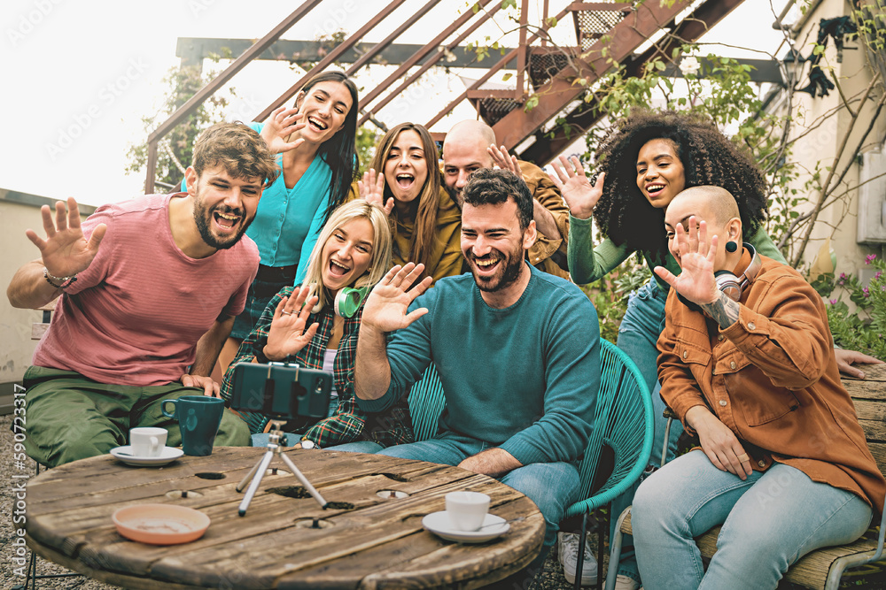 Diverse Friends in a Video Call Together: Seven friends sitting around ...