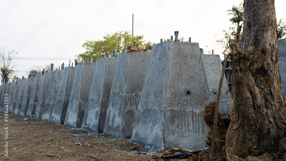 Numerous concrete pillar bases, which were built by cement casting in a ...