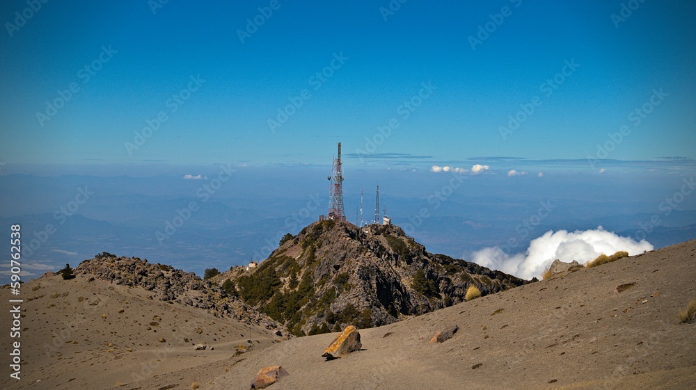Antenna on top of the rocky peak of a mountain in Guzman city Mexico ...