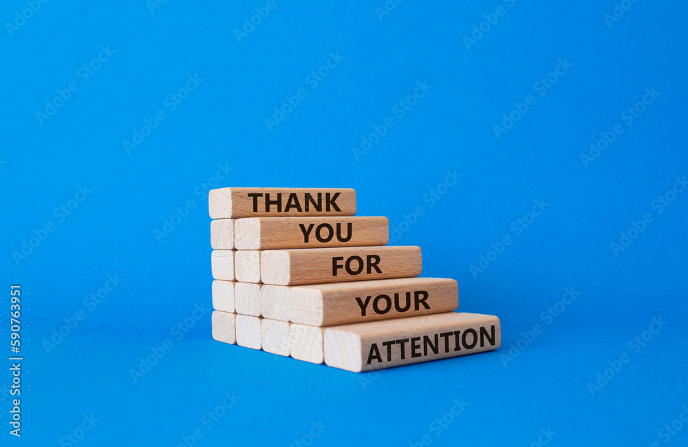 Attention symbol. Wooden blocks with words Thank you for your attention ...