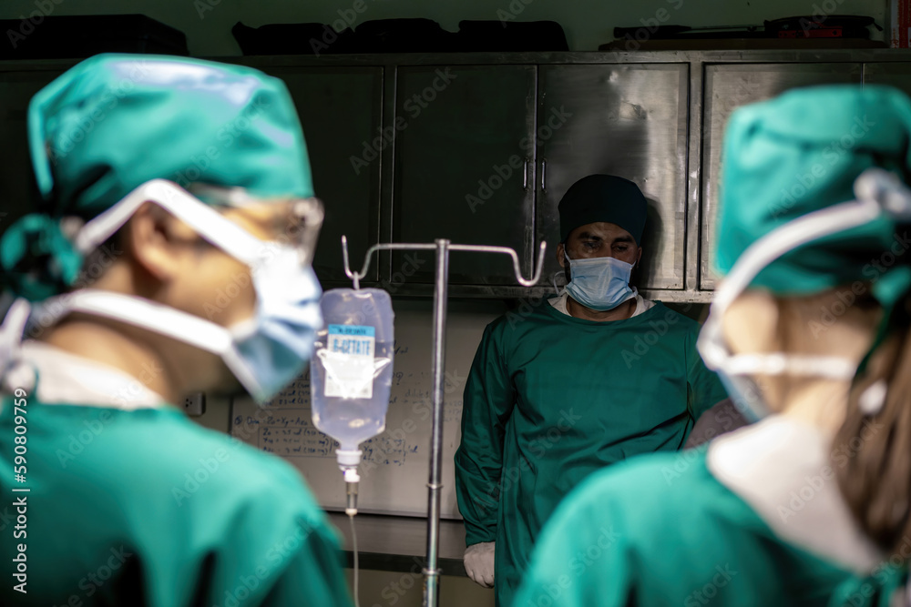 tired male caucasian doctor break operating. specialist surgical man ...