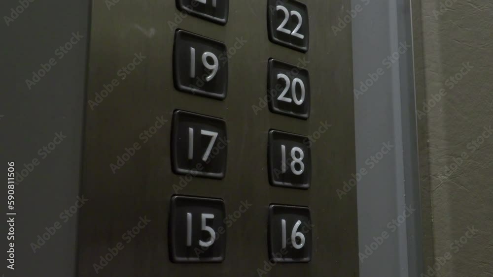 Pushing Elevator Button. Hand pressing lift button up to high floor of ...
