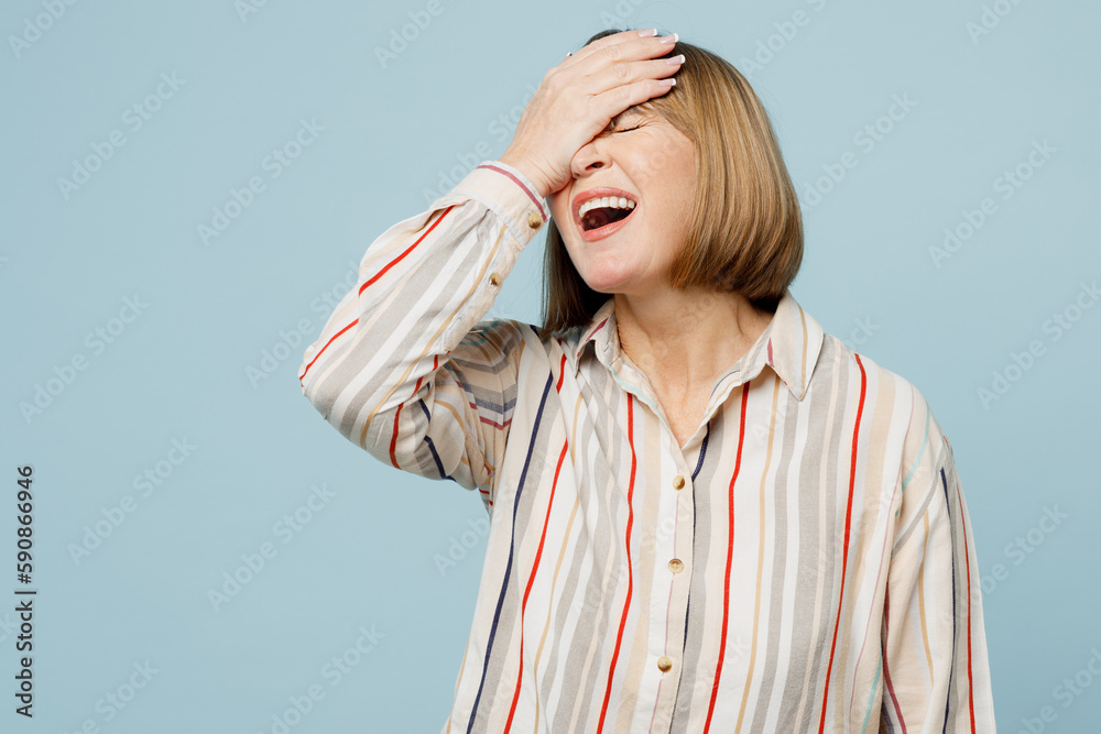 Elderly sad woman 50s years old wear light striped shirt put hand on ...
