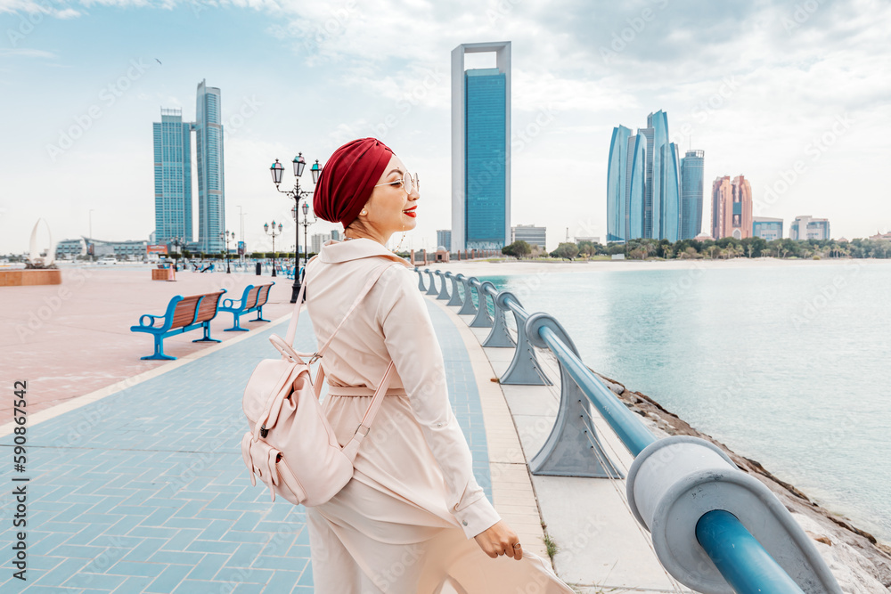 Against the stunning backdrop of Abu Dhabi's skyline, a confident young ...