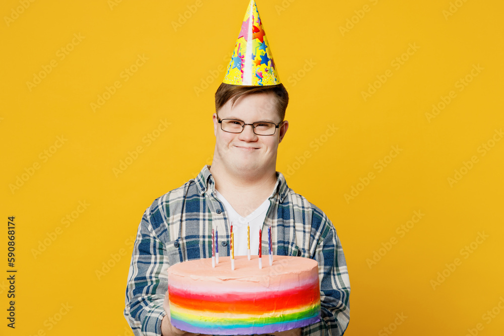 Young smiling man with down syndrome wear glasses casual clothes look ...