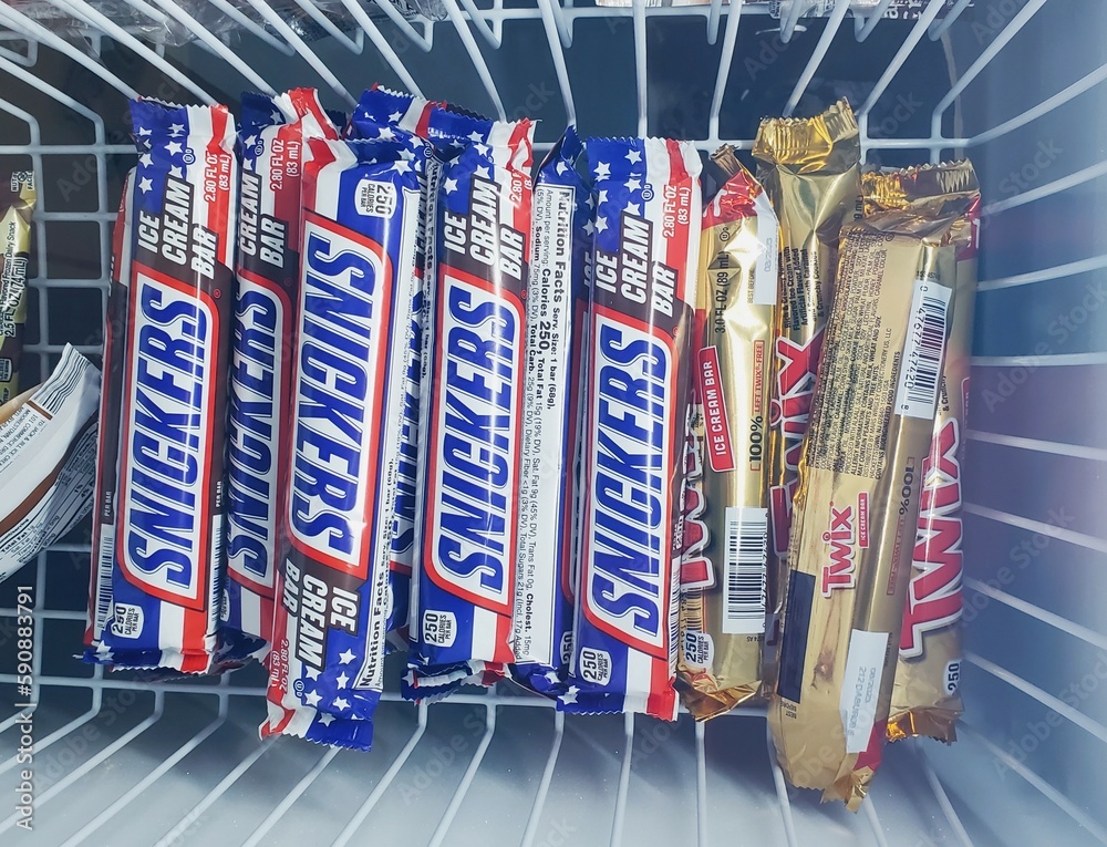 Bally, Pennsylvania, U.S - April 7, 2023 - A stack of Snickers and Twix ...