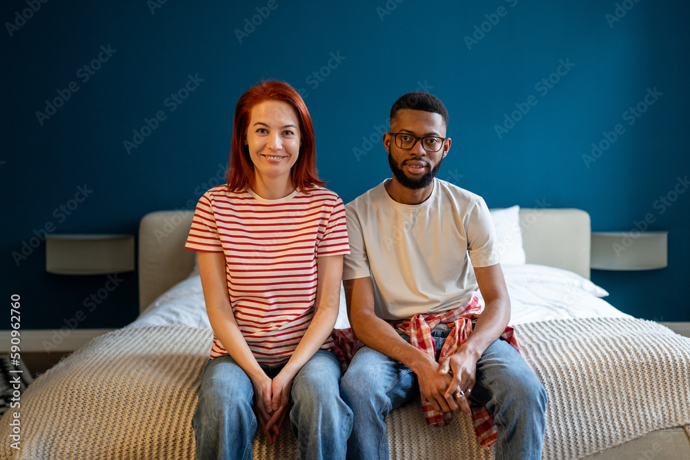 Portrait Of Happy Just Married Interracial Diverse Couple Smiling At