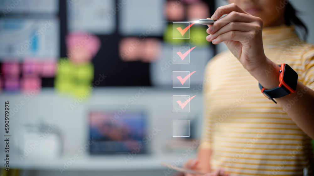 Checklist concept, Businesswoman checking marks on the checkboxes ...