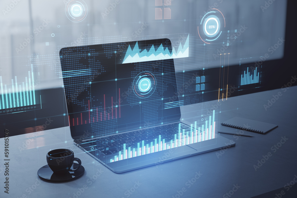 Close up of laptop computer on desk with coffee cup and glowing digital ...