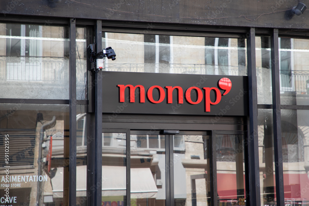 Monop' logo brand and text sign on new store building supermarket ...