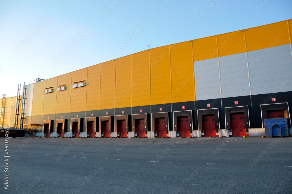 Modern logistics warehouse complex. Loading gate. Garbage container ...