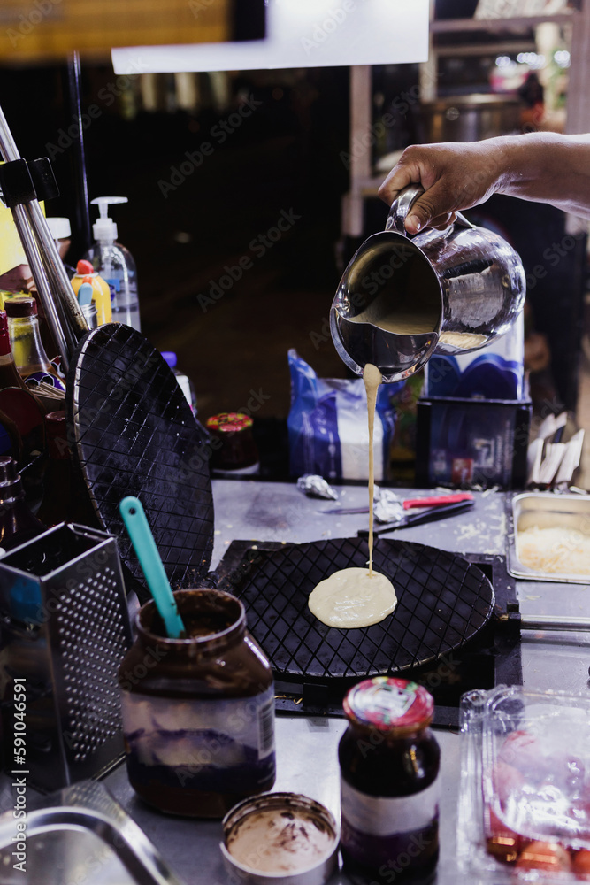 hand preparing Marquesitas mexican dessert traditional in Yucatan and ...