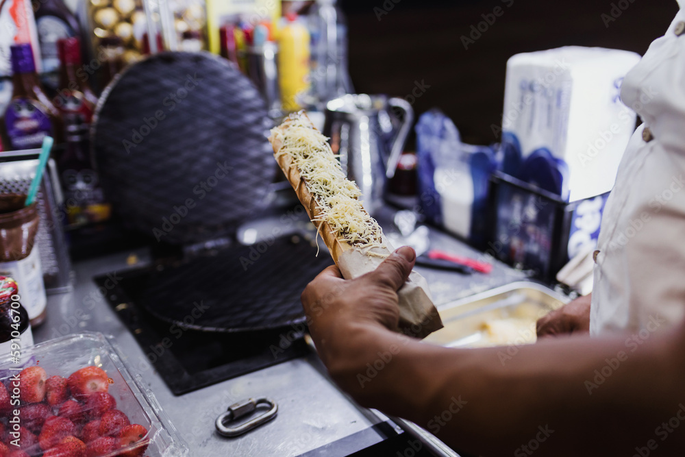 hand preparing Marquesitas mexican dessert traditional in Yucatan and ...