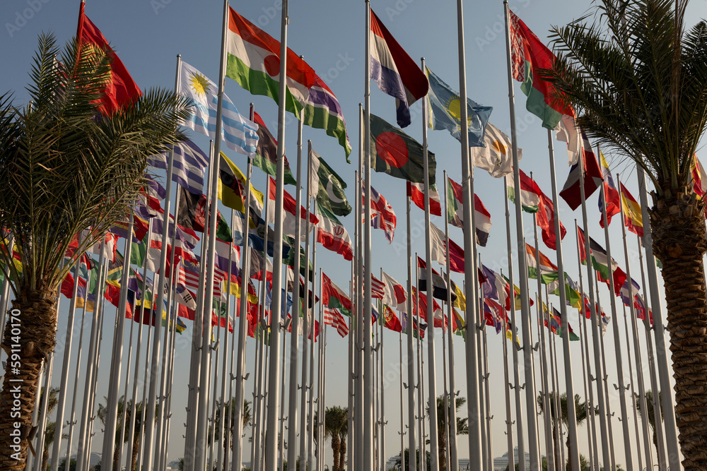 Doha, Qatar - December 12 2022: Flags of countries in the old port of ...