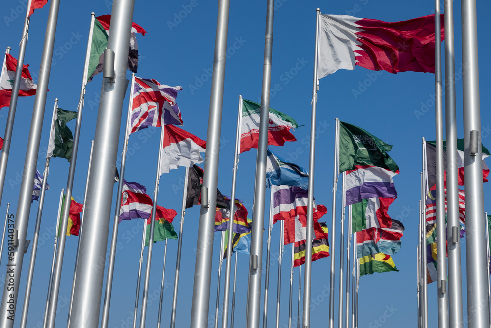 Doha, Qatar - December 12 2022: Flags of countries in the old port of ...
