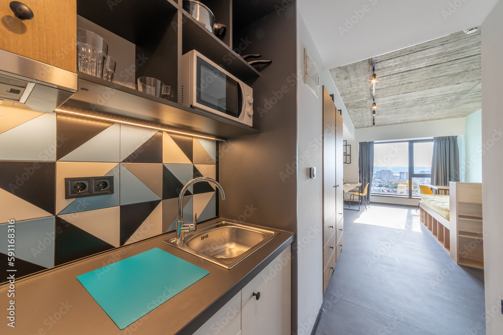 Small modern kitchen in student dorm. Hostel dormitory room. Campus ...