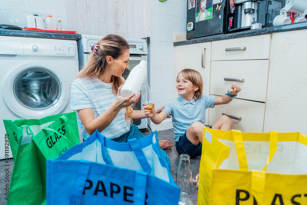 Mother using game is teaching kid how to recycle help the boy aware ...