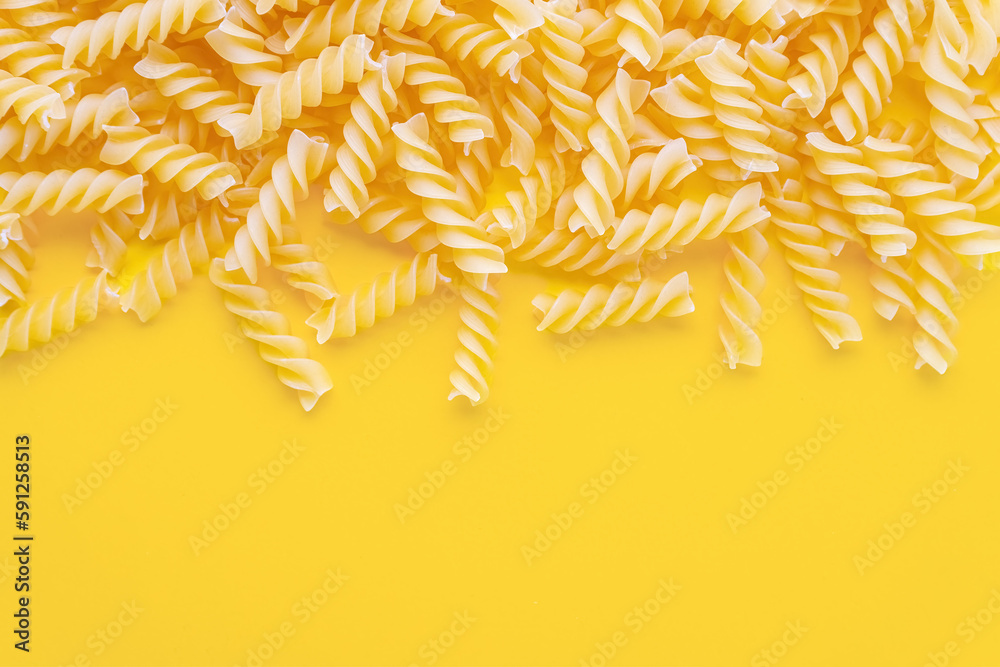 Fusilli spaghetti pattern, food background. Scattered raw pasta ...