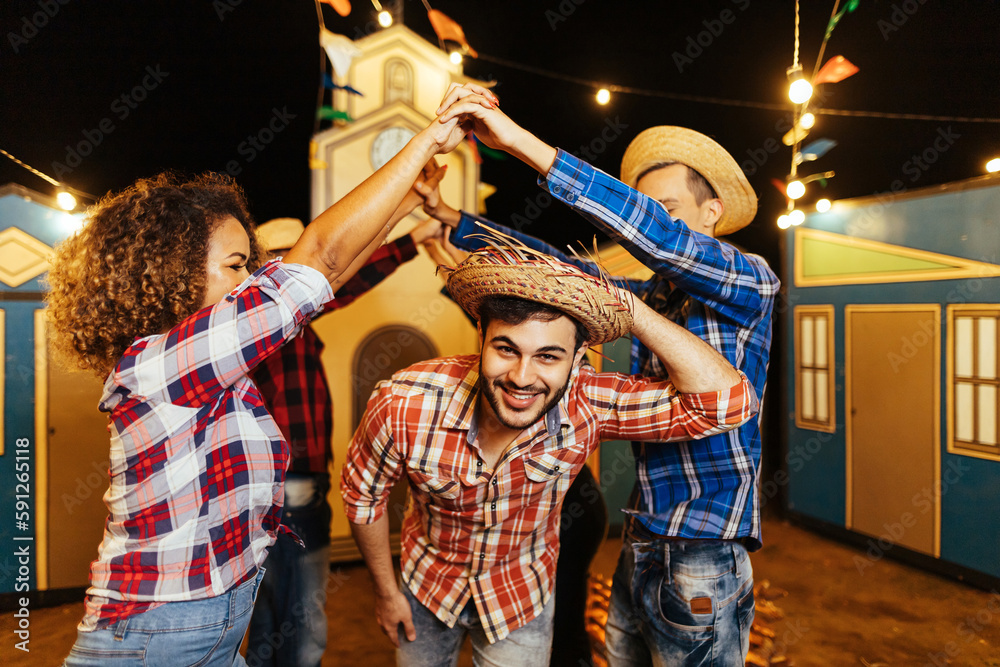 Festa Junina in Brazil. Group of friends dancing the Brazilian square ...