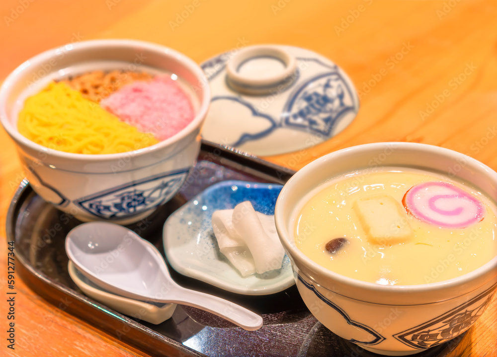 Traditional Japanese egg custard Chawanmushi cuisine with pink sakura ...