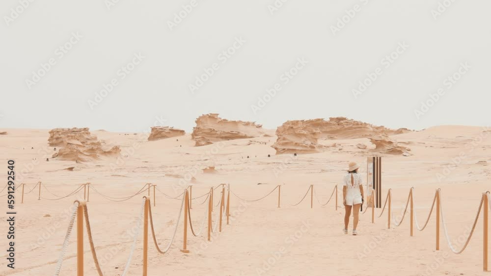 Female tourist visit walk around Fossil Dunes Structures. Abu Dhabi ...